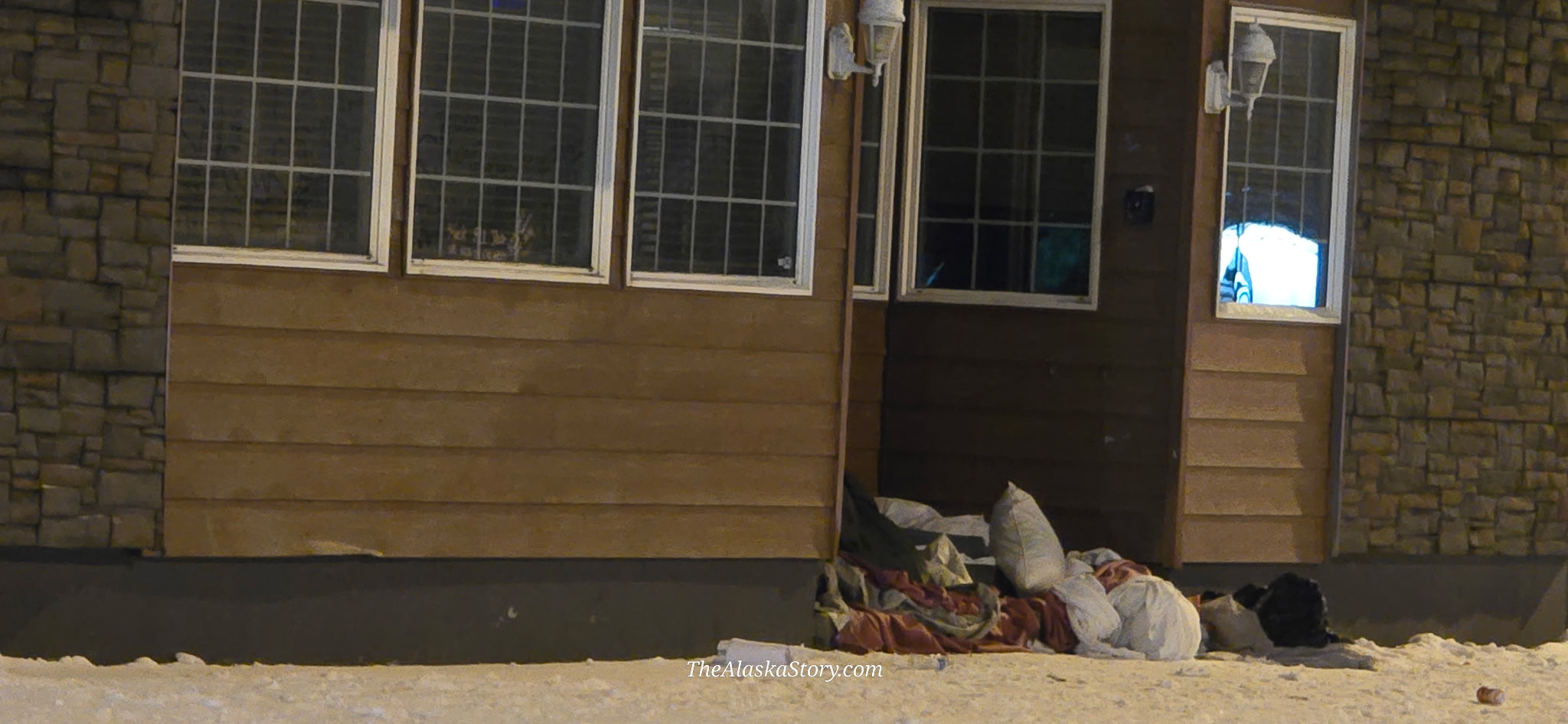 Street people camp in doorway of Anchorage Visitor Center as winter ...
